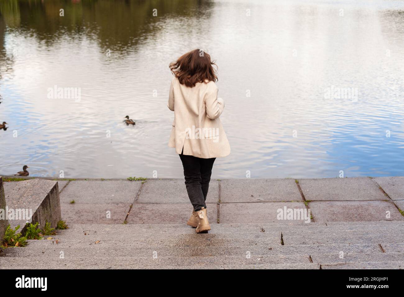 Happy carefree woman walking in park Stock Photo - Alamy