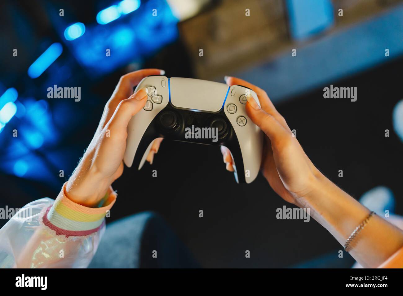 Portrait of a young female gamer playing console Stock Photo - Alamy