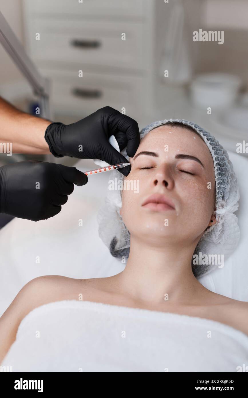woman receives cosmetic botox injection in face Stock Photo - Alamy