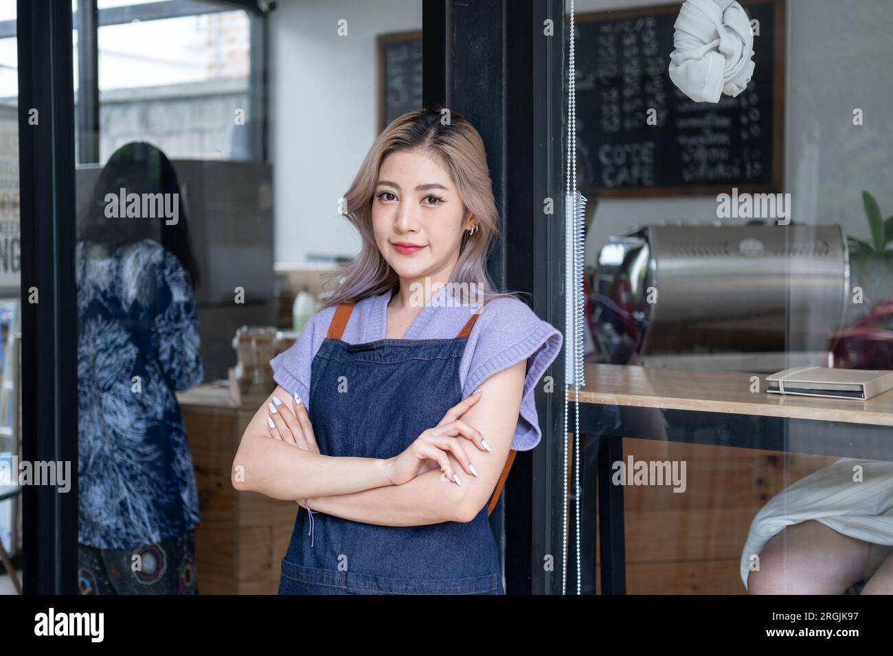 Happy young business owner waitress standing at restaurant coffee shop ...