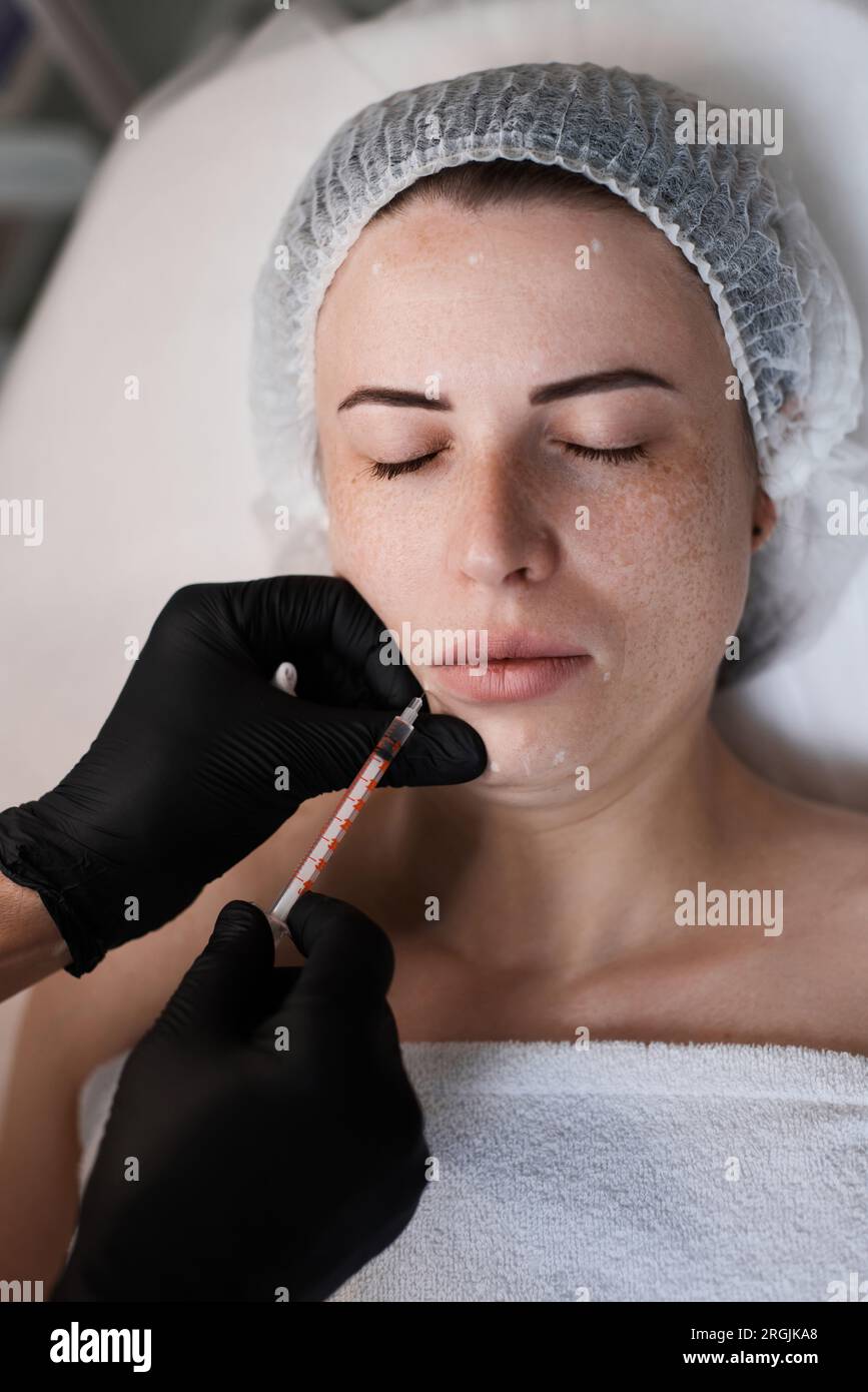 woman receives cosmetic botox injection in face Stock Photo - Alamy