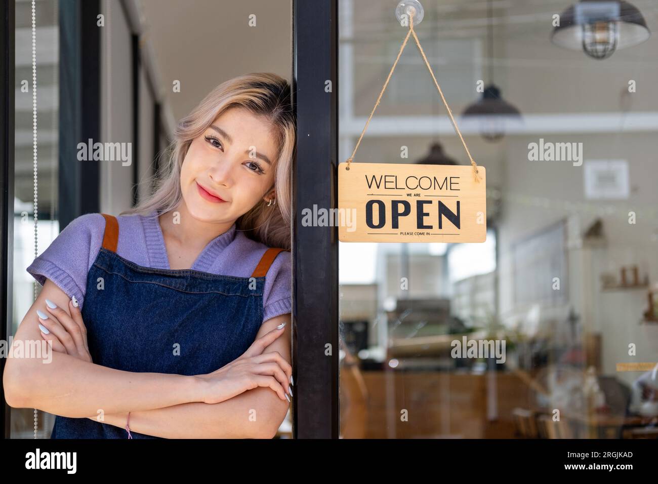 Happy young business owner waitress standing at restaurant coffee shop ...