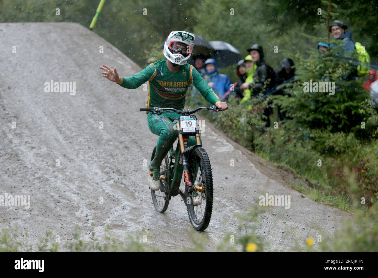 South Africa's Greg Minnaar waves to spectators while struggling with a ...