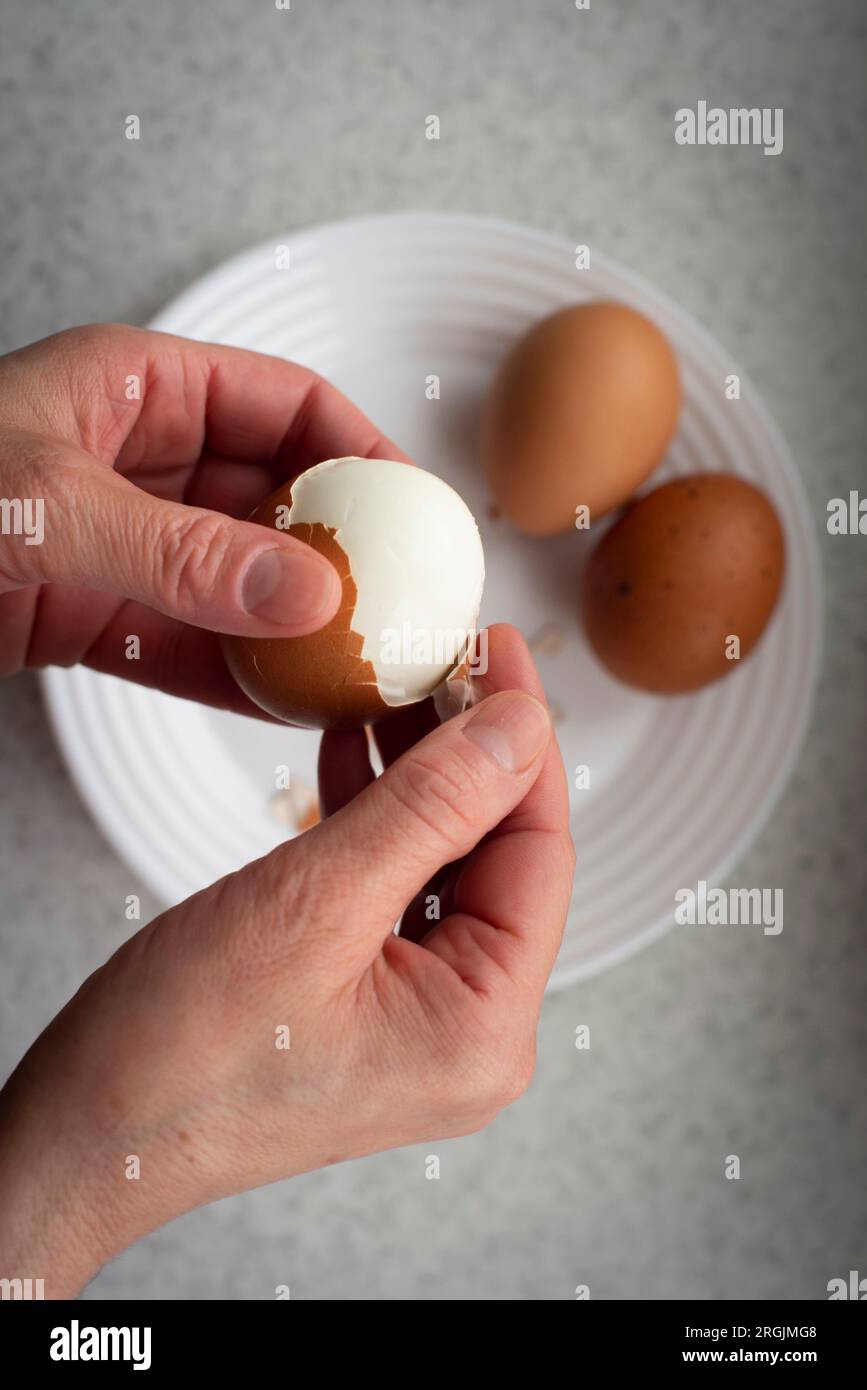 Peeling eggs hi-res stock photography and images - Alamy