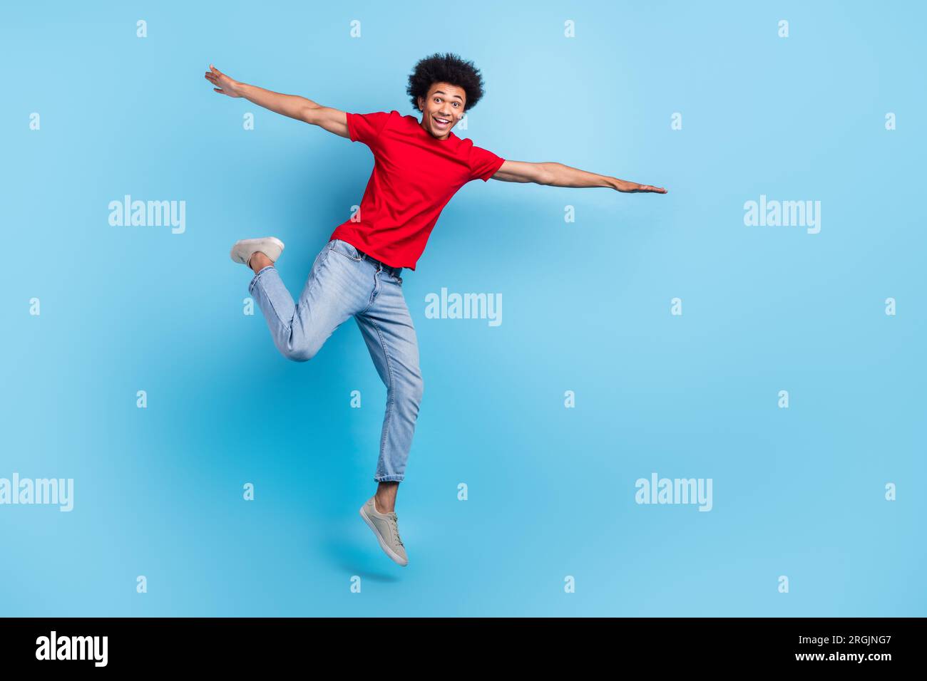 Full body photo of jumping flying wings hands youngster guy feel free ...