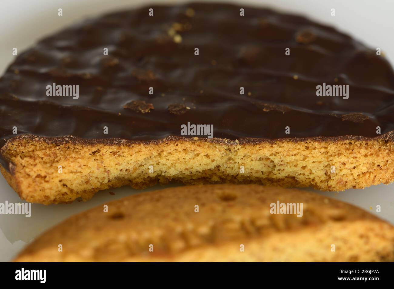 Sugar free chocolate digestive biscuit broken in half Stock Photo - Alamy