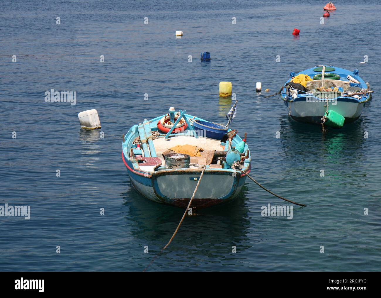 Colorful Greek Fishing Boats and Buoys in Symi, Greece Stock Photo - Alamy