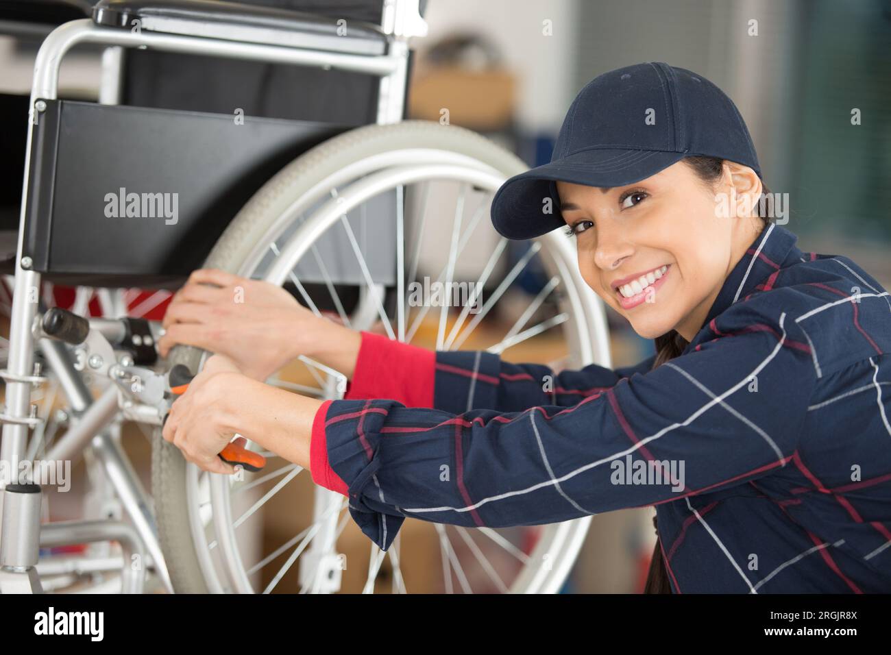 female mechanic maintaining a wheelchair Stock Photo - Alamy