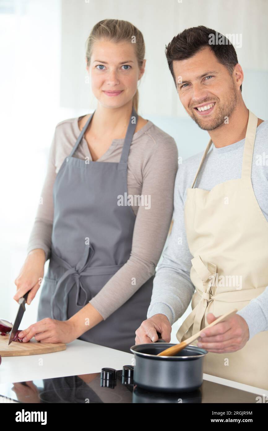 loving couple cooking together in the kitchen at home Stock Photo - Alamy