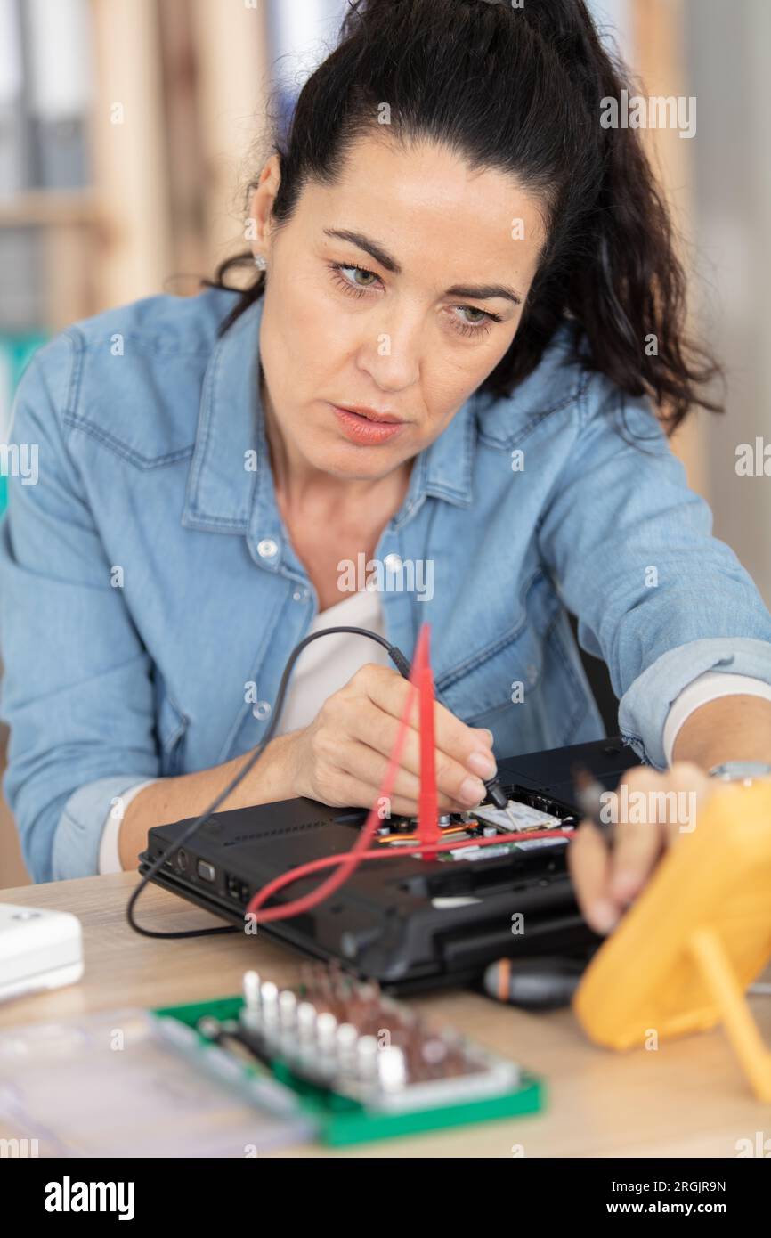 Repairing electronics woman hi-res stock photography and images - Alamy