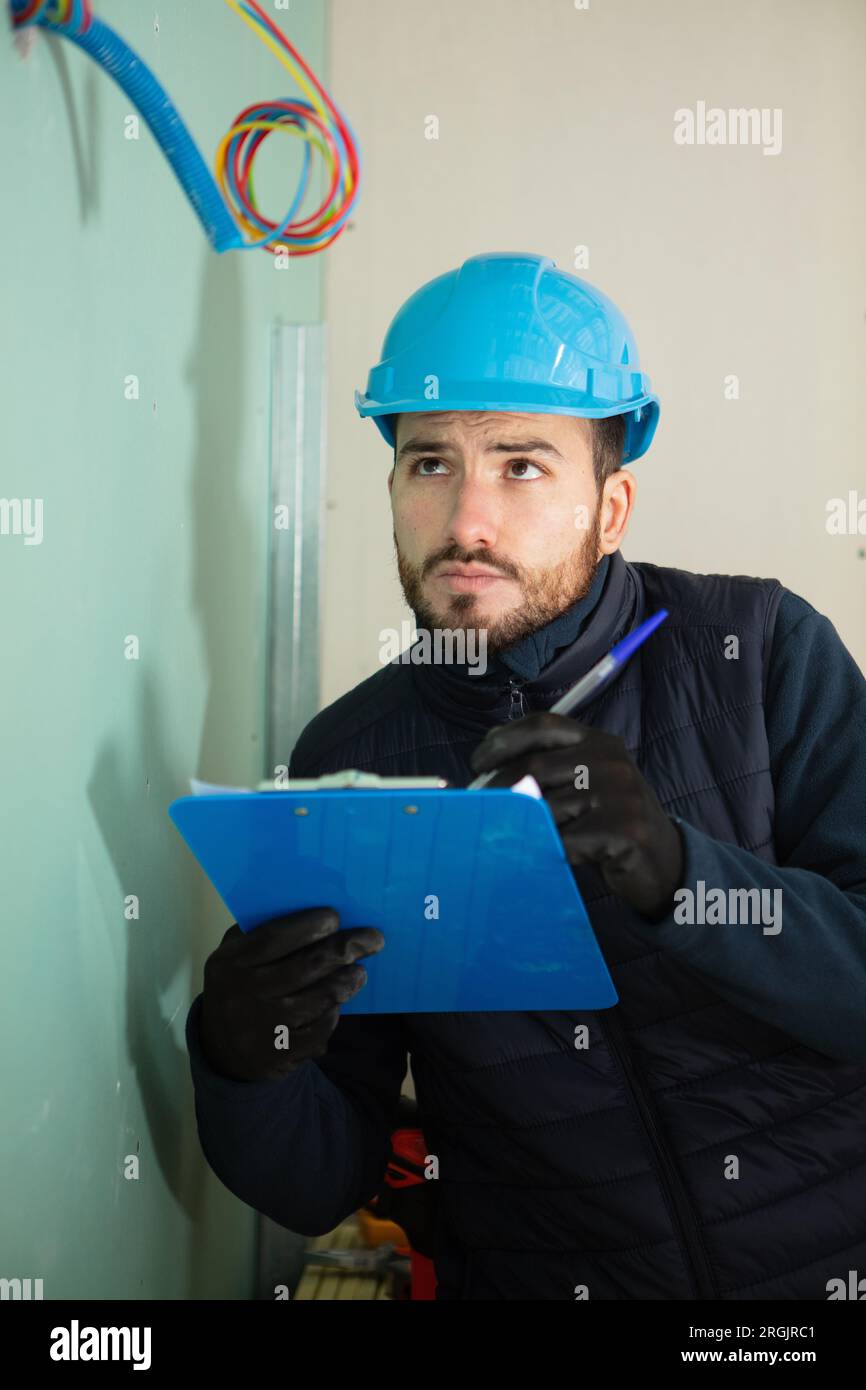confident service man taking notes Stock Photo - Alamy