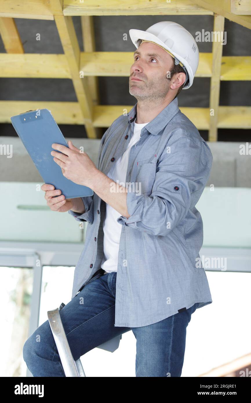 an male employee with clipboard Stock Photo - Alamy