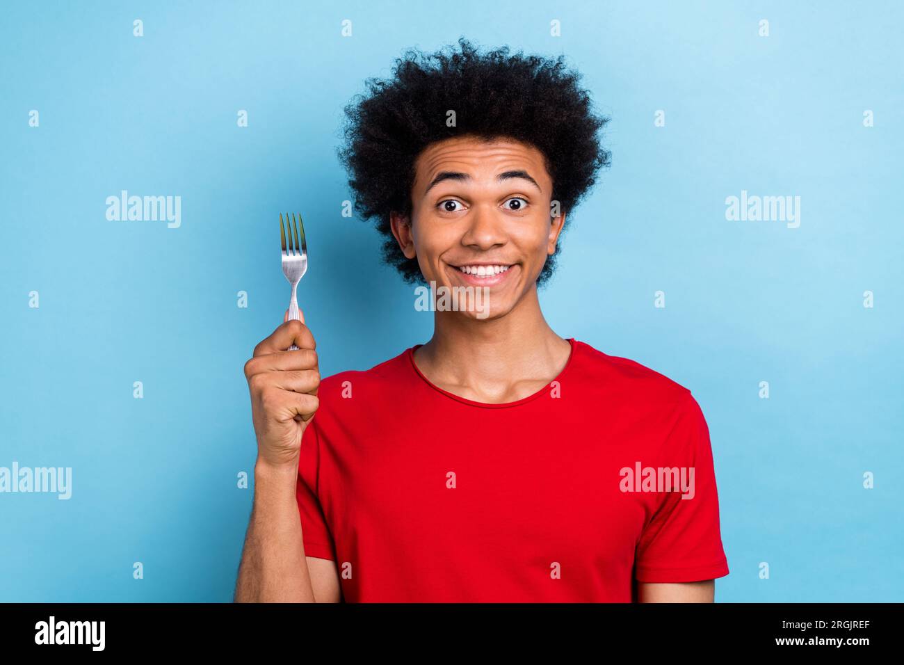 Photo of cheerful attractive person beaming smile hand hold fork ...