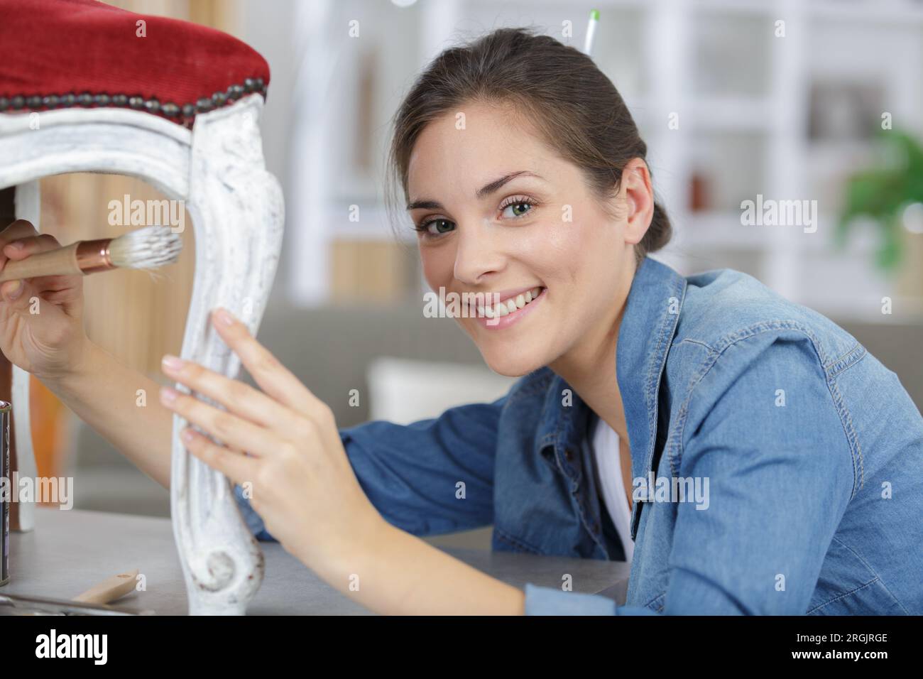 portrait of a female working wooden chair Stock Photo - Alamy