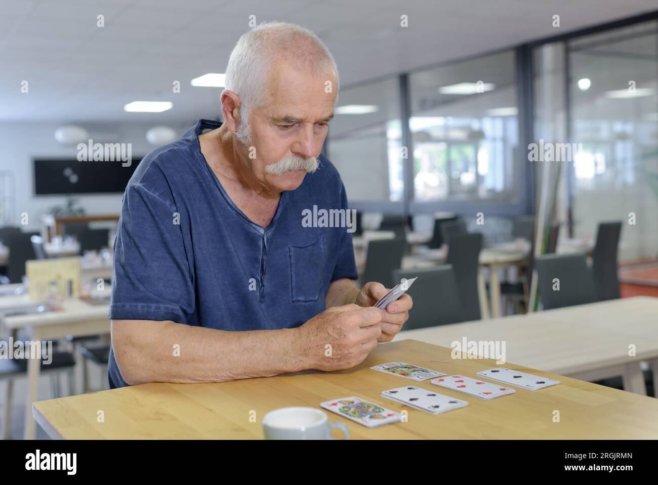 retired people playing card in a retirement home Stock Photo - Alamy
