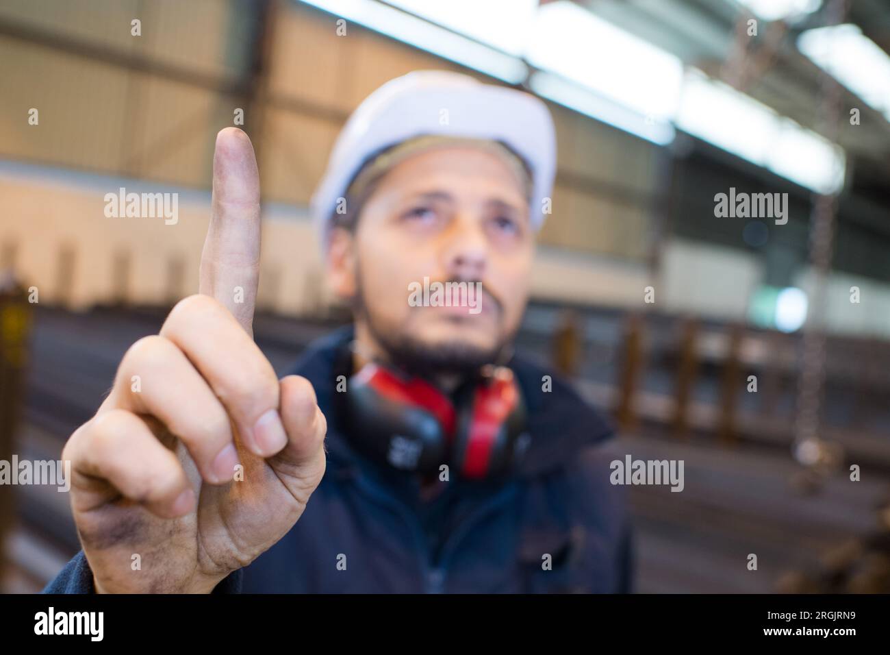 factory supervisor monitoring product levels on interactive display ...
