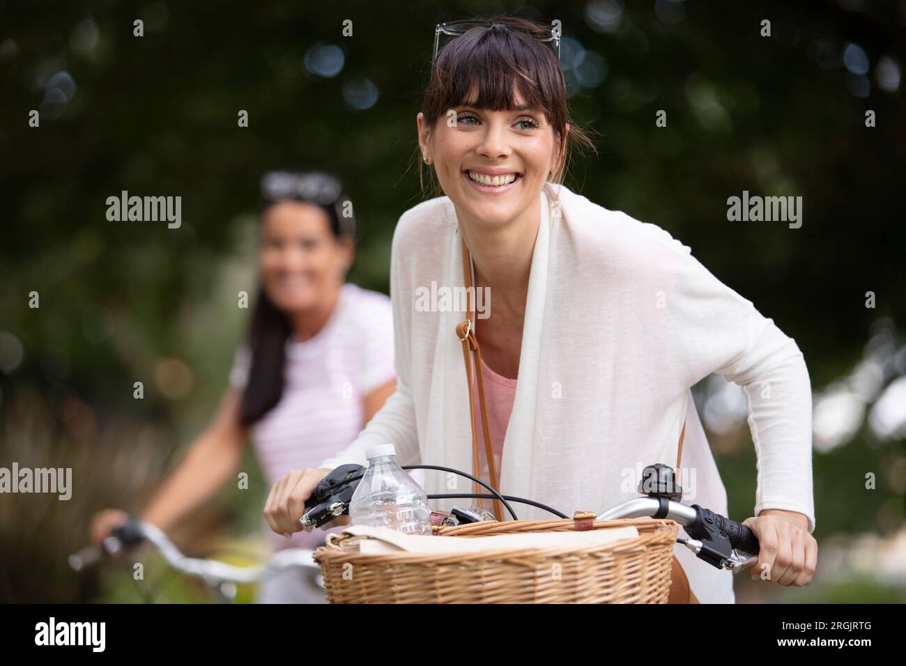 Beautiful smiling girl riding bicycle hi-res stock photography and ...