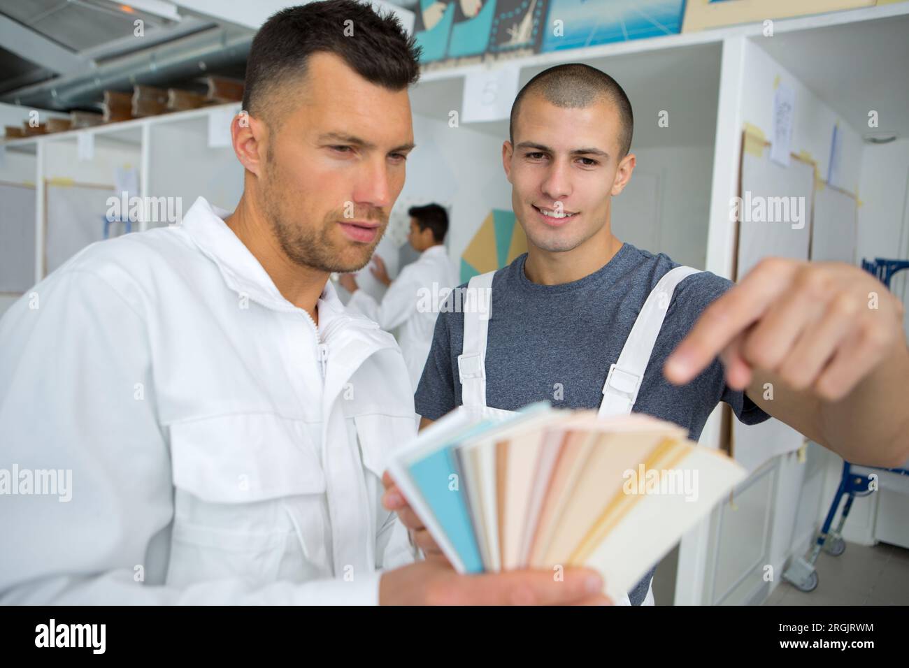 young man choosing a color swatch Stock Photo - Alamy