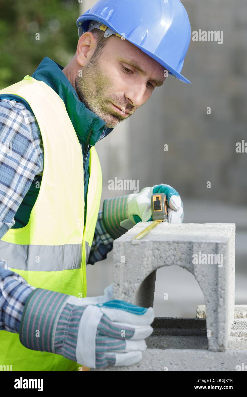 a worker in safety helmet in construction Stock Photo - Alamy