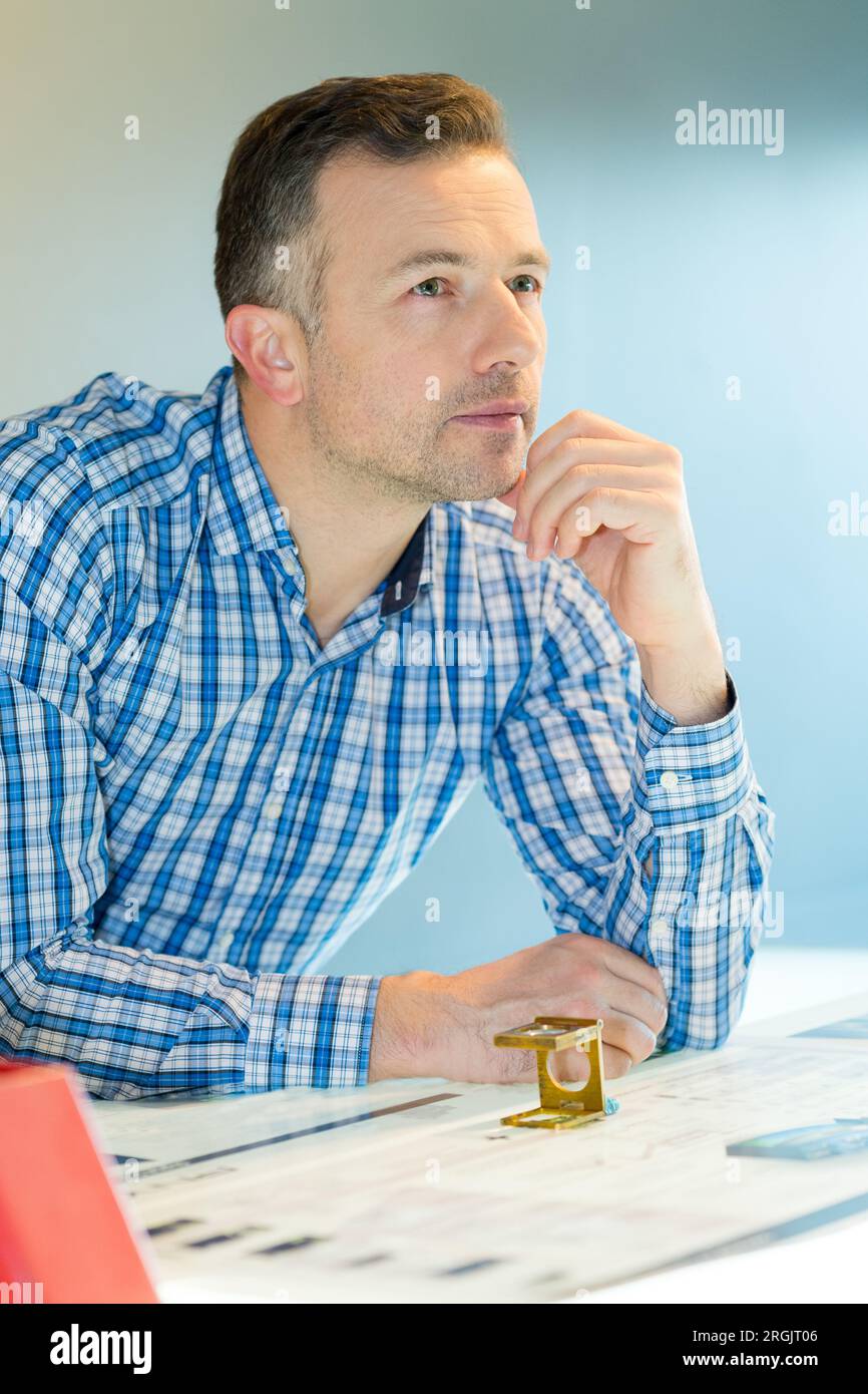 a printing press professional thinking Stock Photo - Alamy