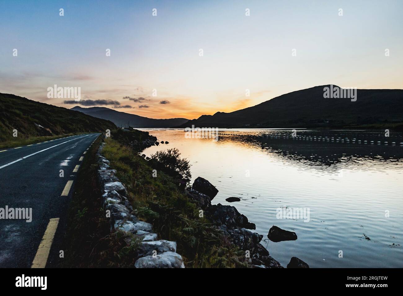 Killary Harbour or Fjord at sunset with the scenic Connemara loop road ...