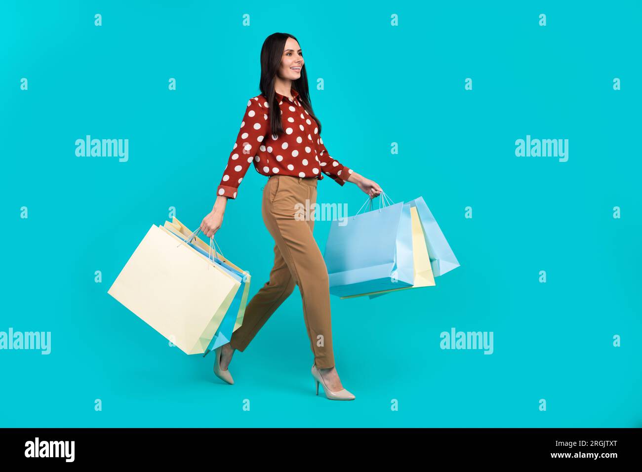 Full body profile photo of pretty lady hold boutique bags walking empty ...