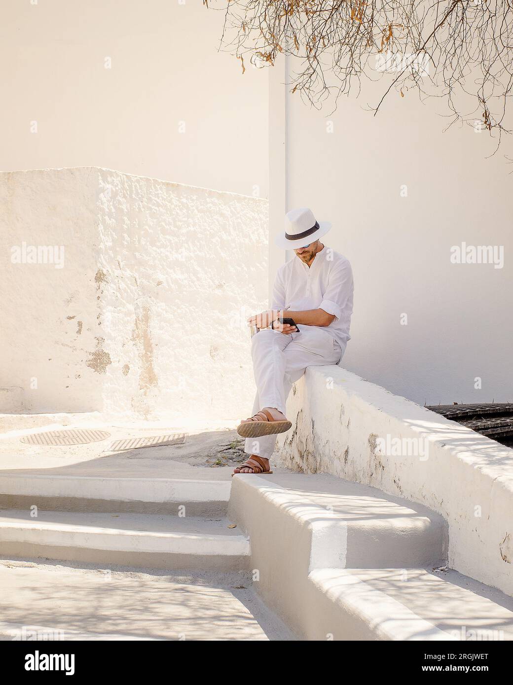Contemplative Man on a Wall Stock Photo - Alamy