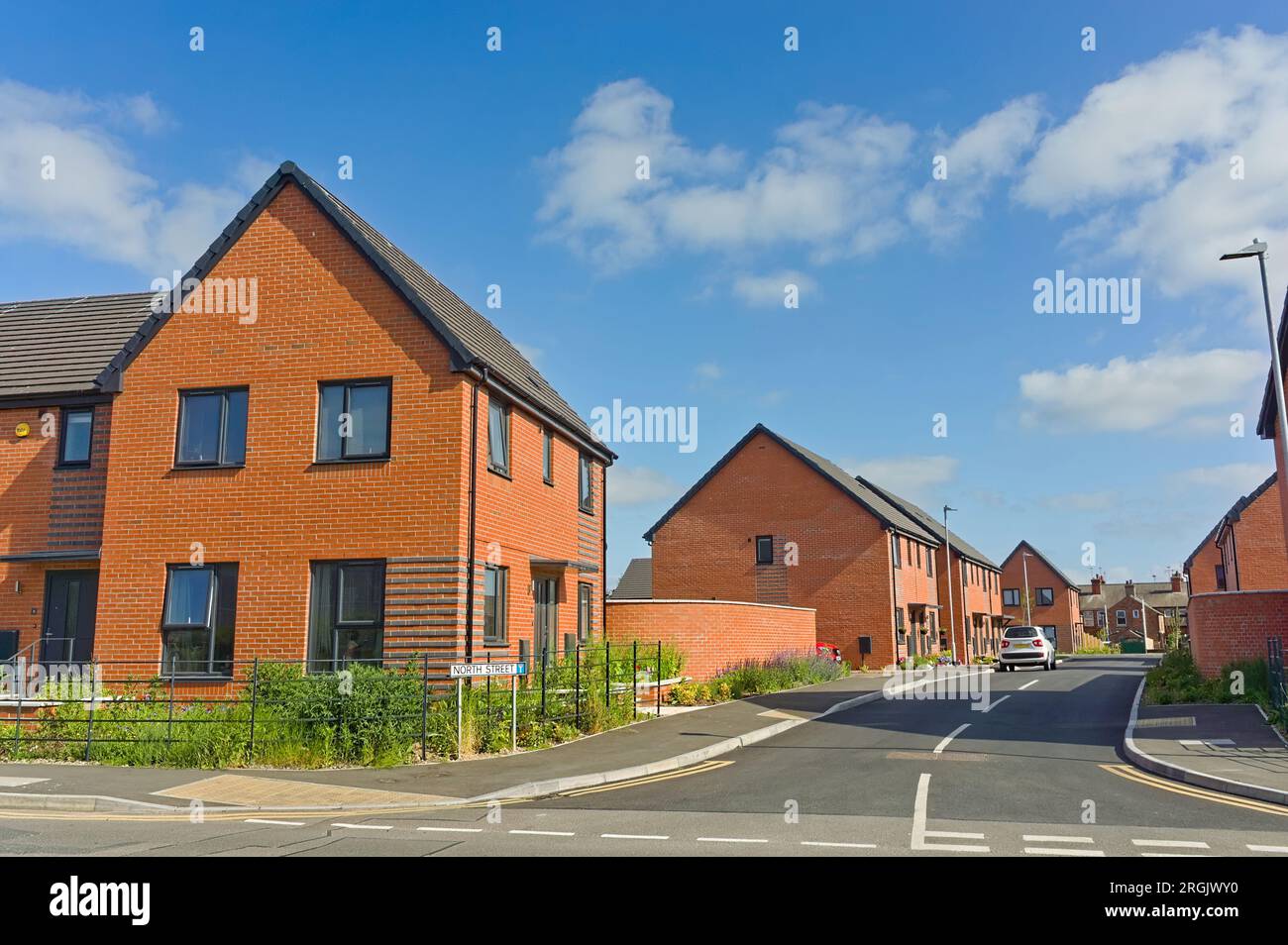 A newly built housing estate in the middle of town on a sunny day Stock ...