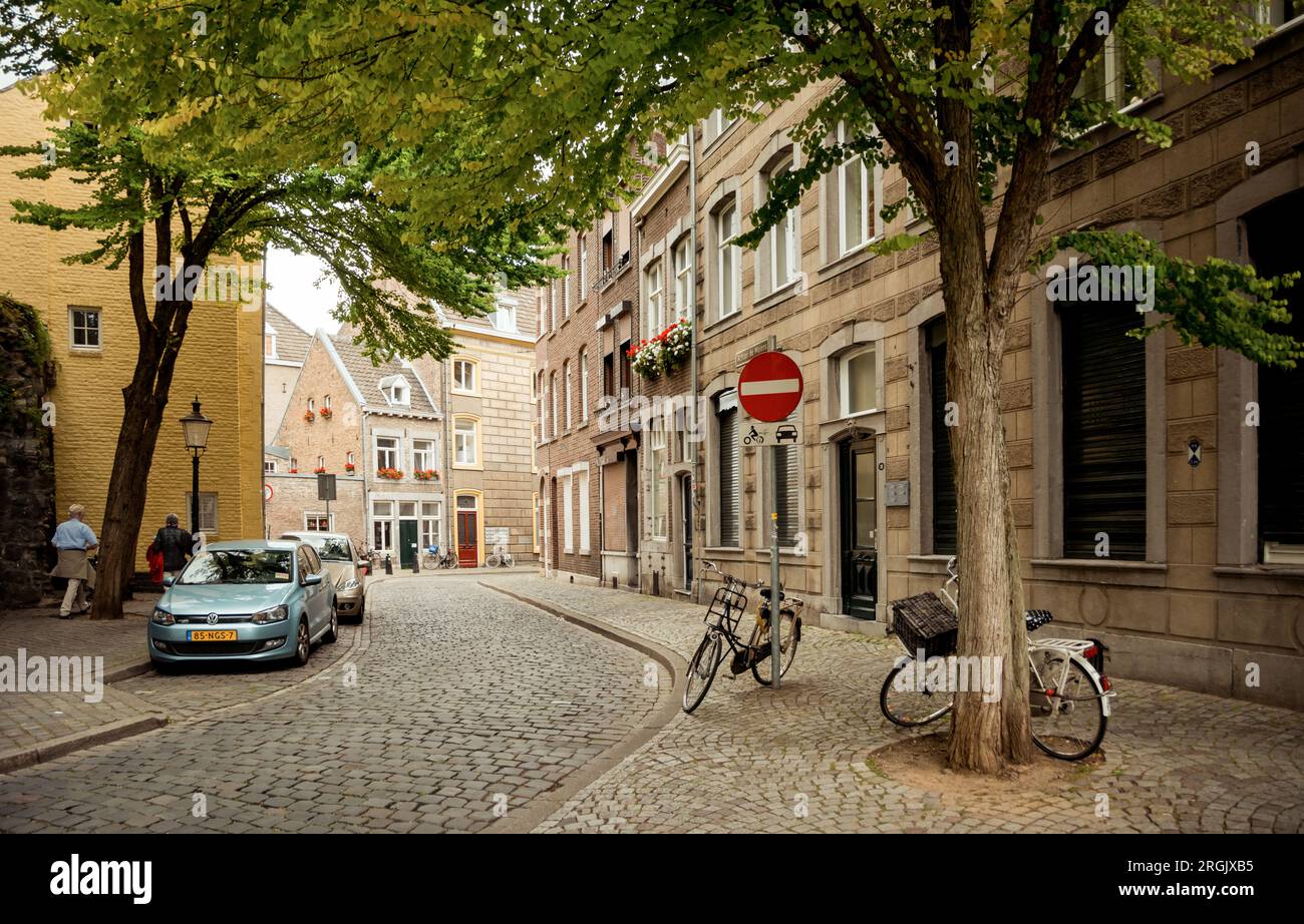 street in old districts of Maastricht on Sunday afternoon. Narrow ...