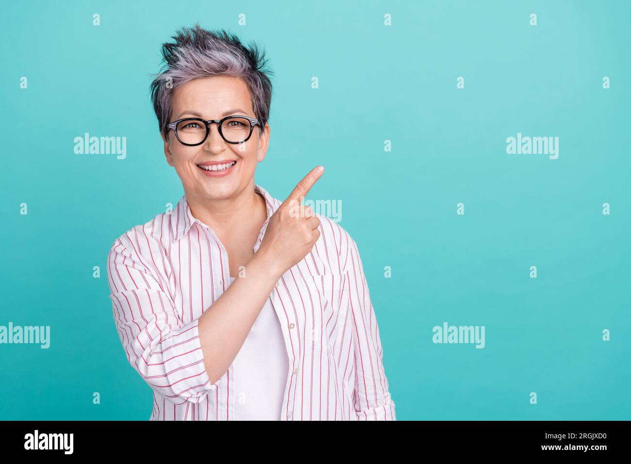 Photo of beautiful assistant woman assistant worker demonstrate finger ...