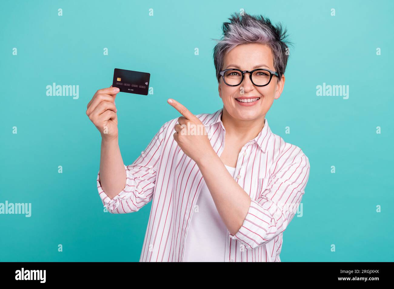 Photo of mature age business lady promoter direct finger plastic debit ...