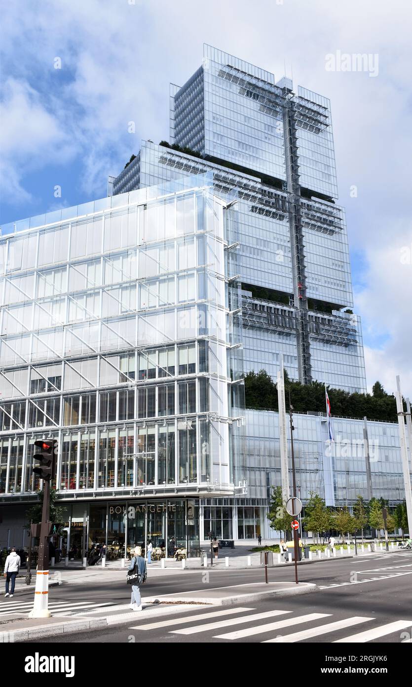 Clouds & blue sky reflected in the glazing of the hi-tech, energy ...