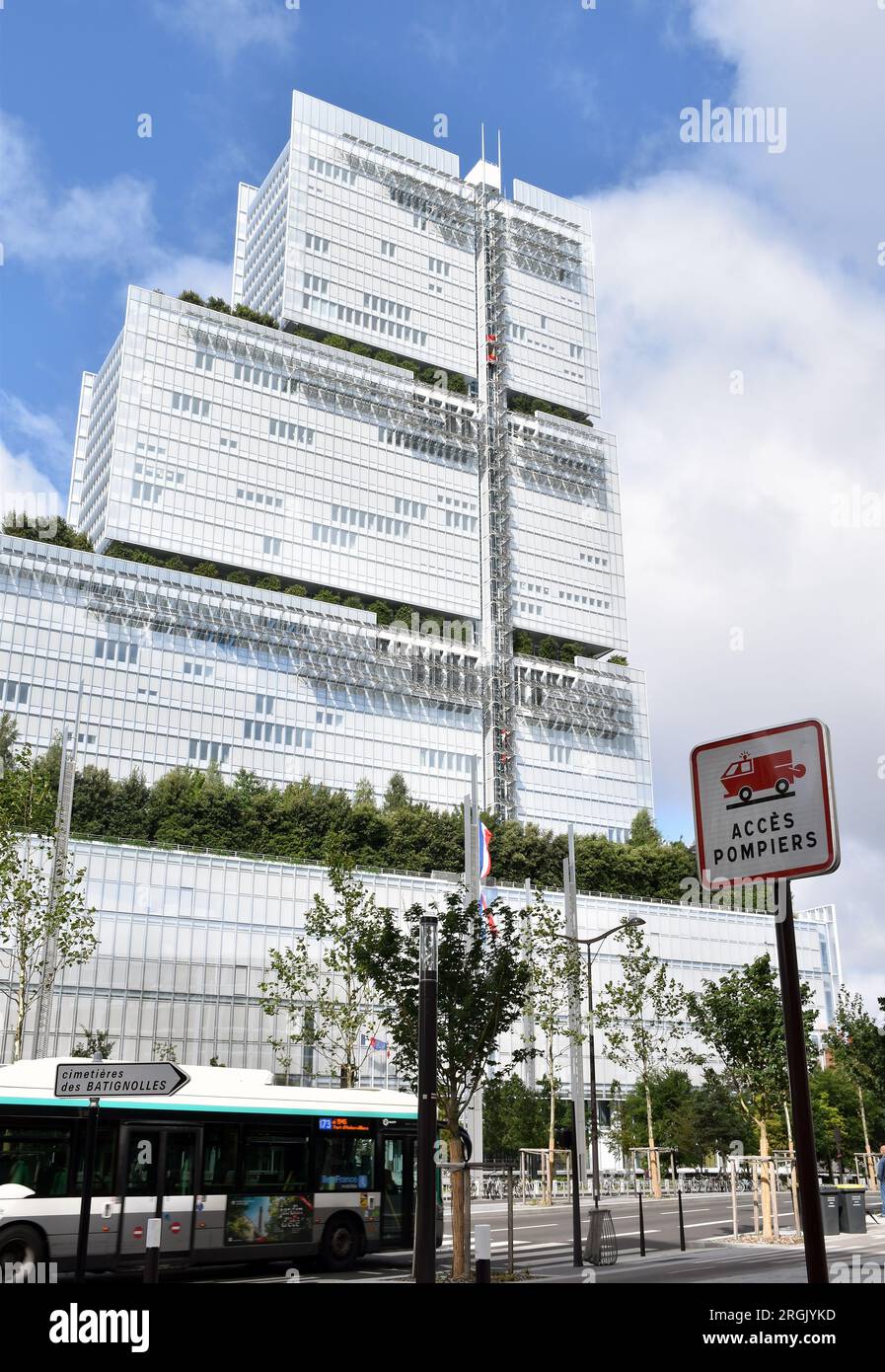 Clouds & blue sky reflected in the glazing of the hi-tech, energy ...