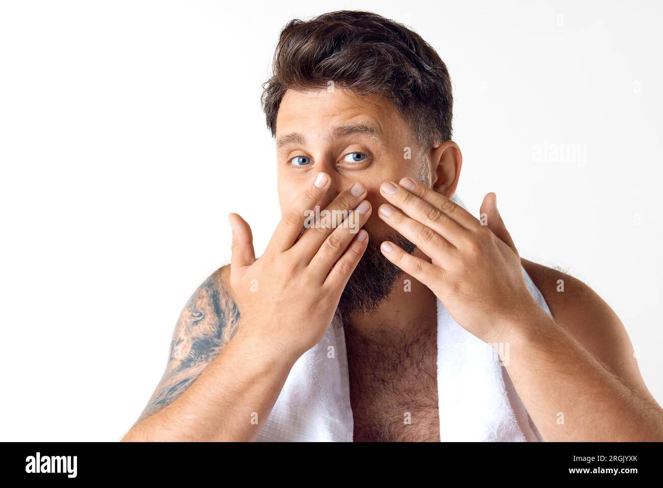 Mature man examining face condition and squeezing pimples, acne against ...