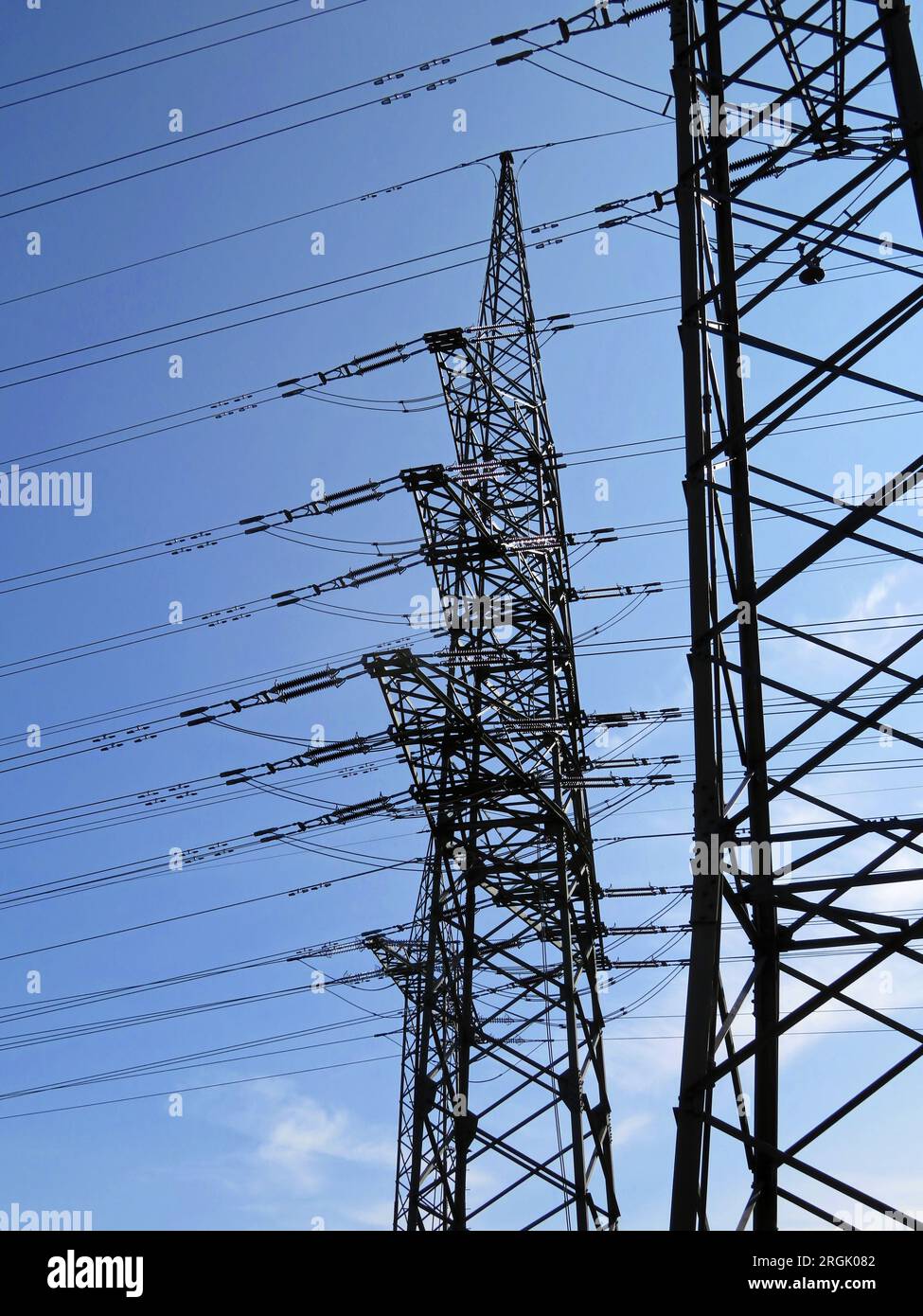 Various electricity pylons with high voltage transmission lines - high ...