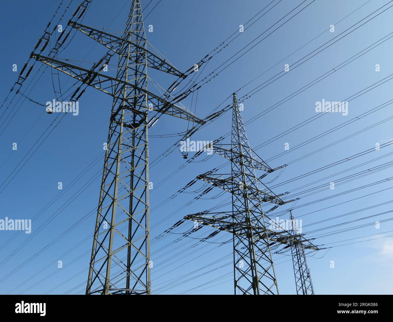 Various electricity pylons with high voltage transmission lines - high ...