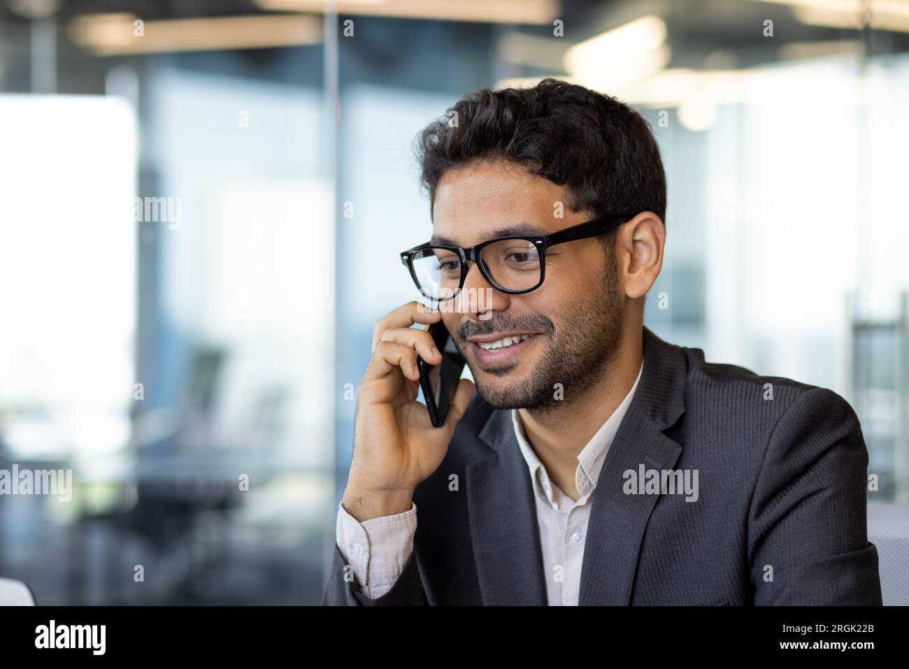 Young successful arab businessman boss talking on phone close up, man ... Young successful arab businessman boss talking on phone close up, man ...