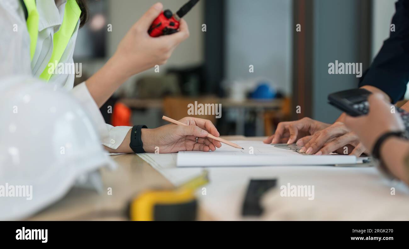 Team of young man and woman engineer and architects working, meeting ...