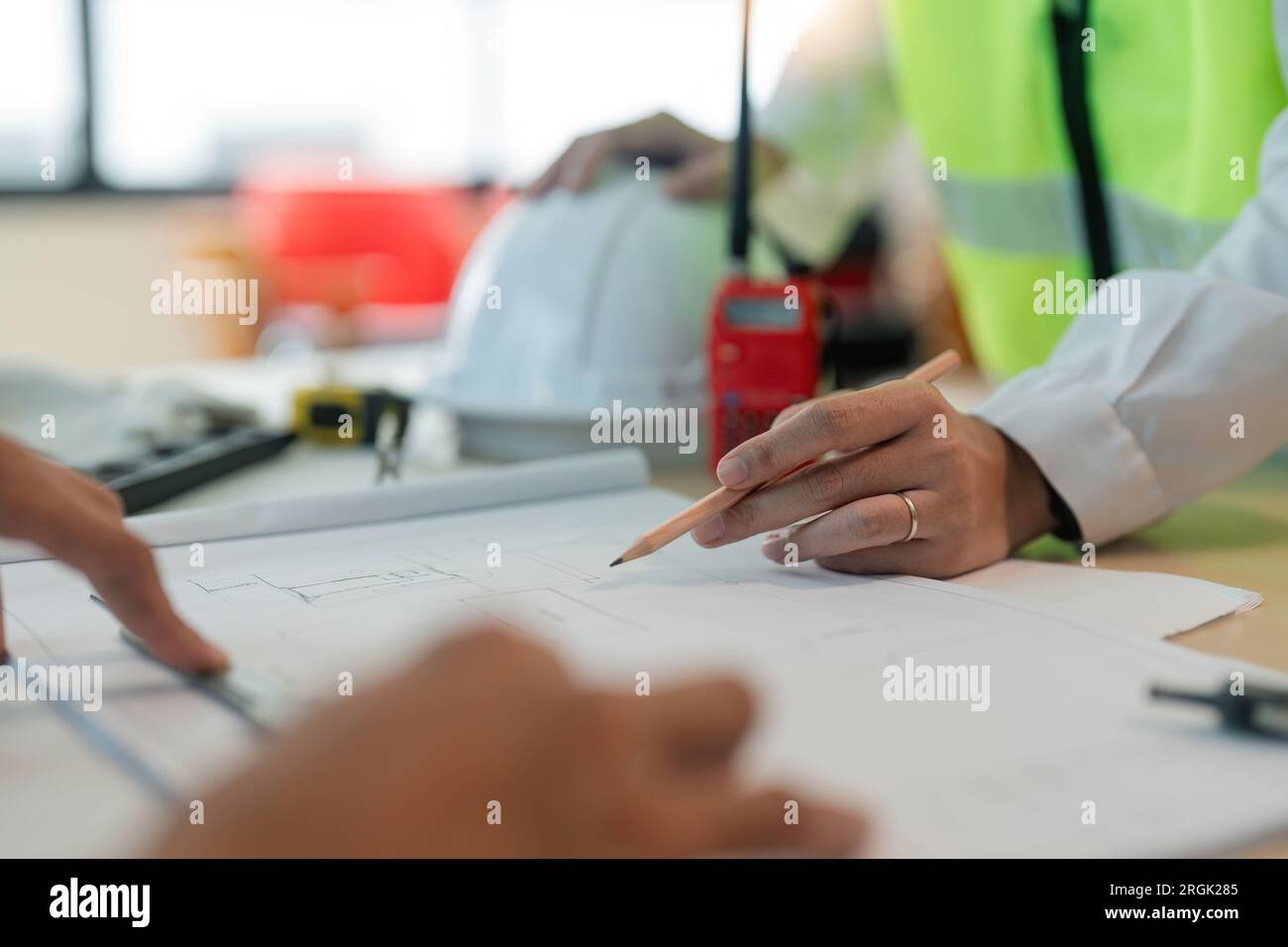 Team of young man and woman engineer and architects working, meeting ...