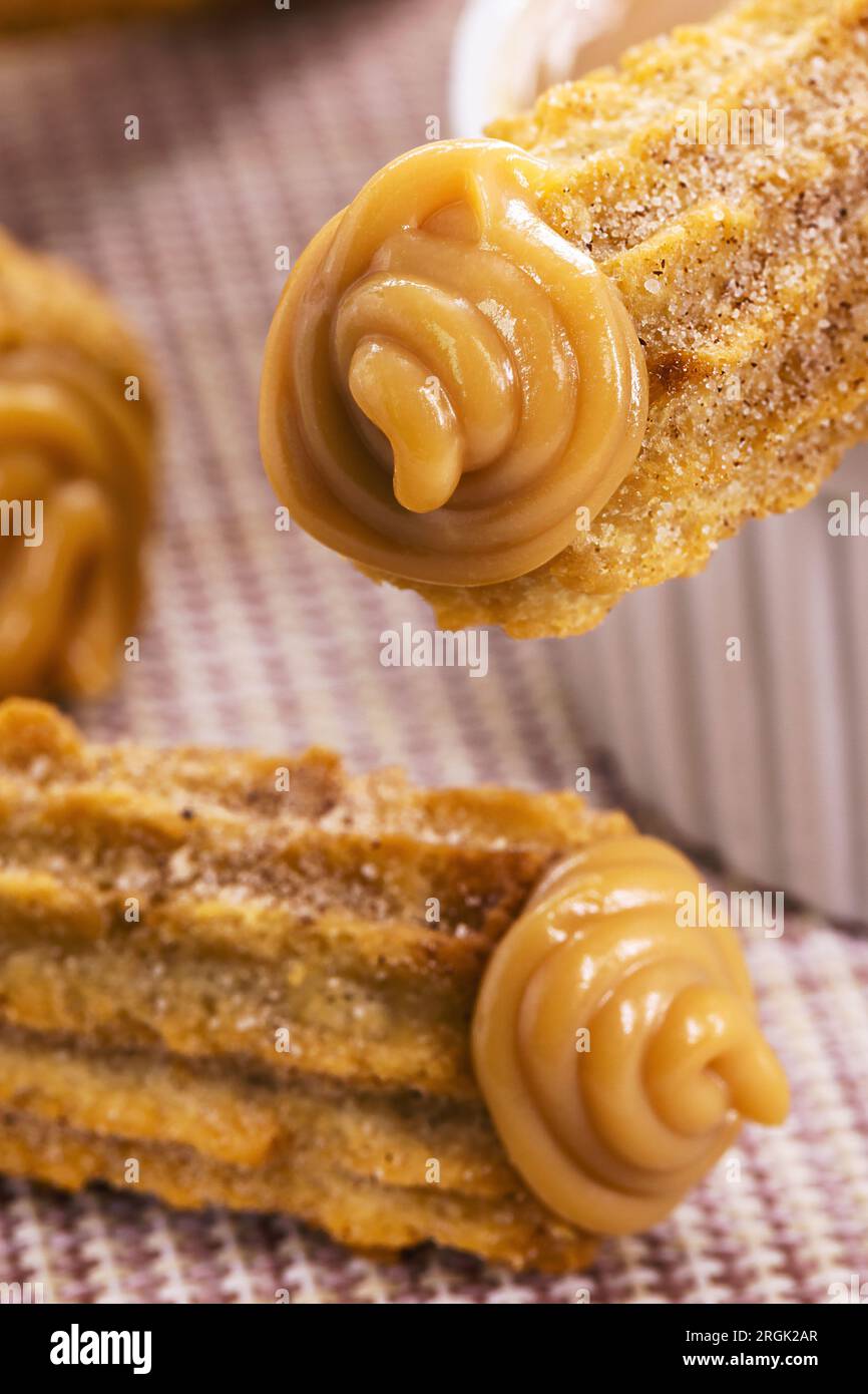 churros, fried sweet stuffed with dulce de leche, traditional from ...