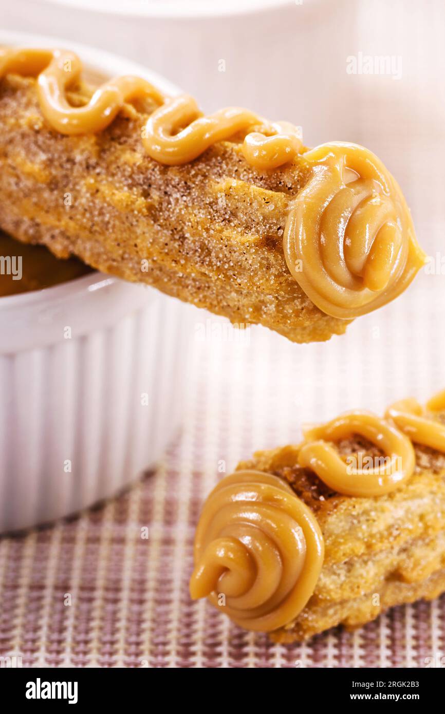 churros, fried sweet stuffed with dulce de leche, traditional from ...