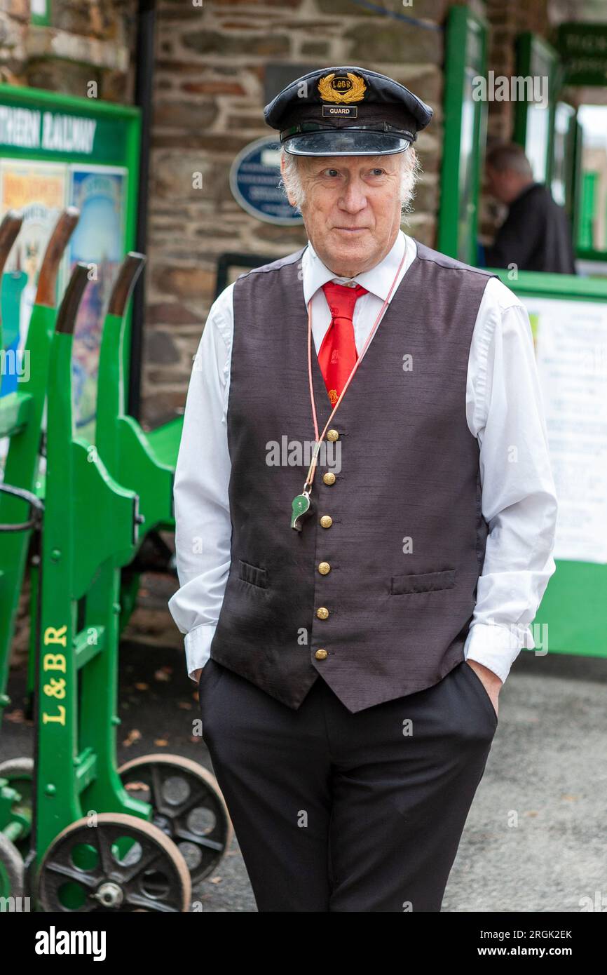 Happy in his work: a volunteer guard in uniform with whistle on the ...
