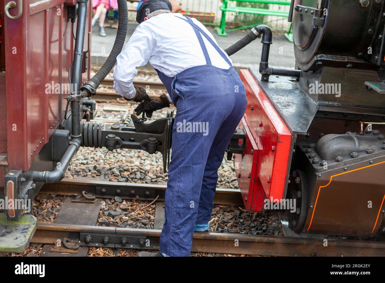 Volunteer rail worker on the heritage narrow-gauge Lynton and ...