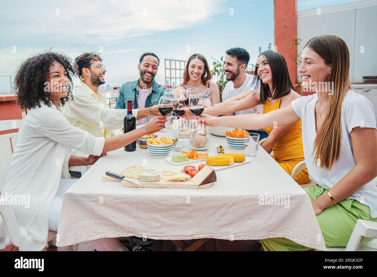 Multicultural friends sharing joyful rooftop hi-res stock photography ...