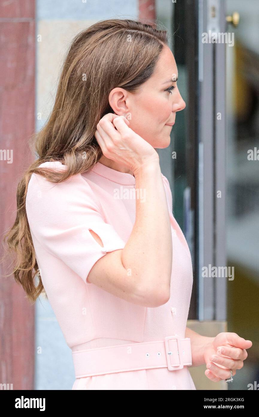 Catherine, the Princess of Wales, in a pink Belua dress, opens the ...