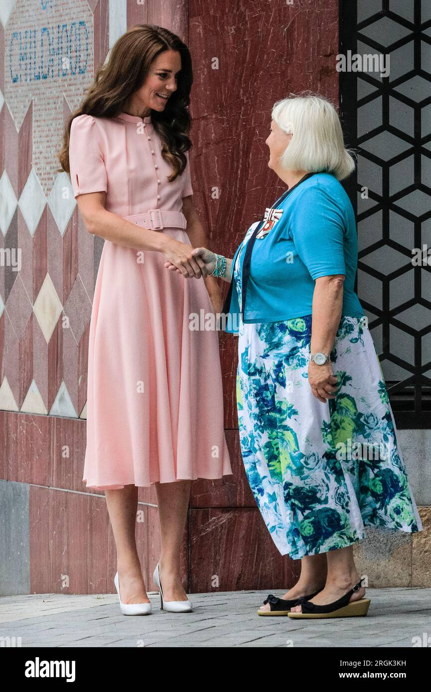 Catherine, the Princess of Wales, in a pink Belua dress, opens the ...