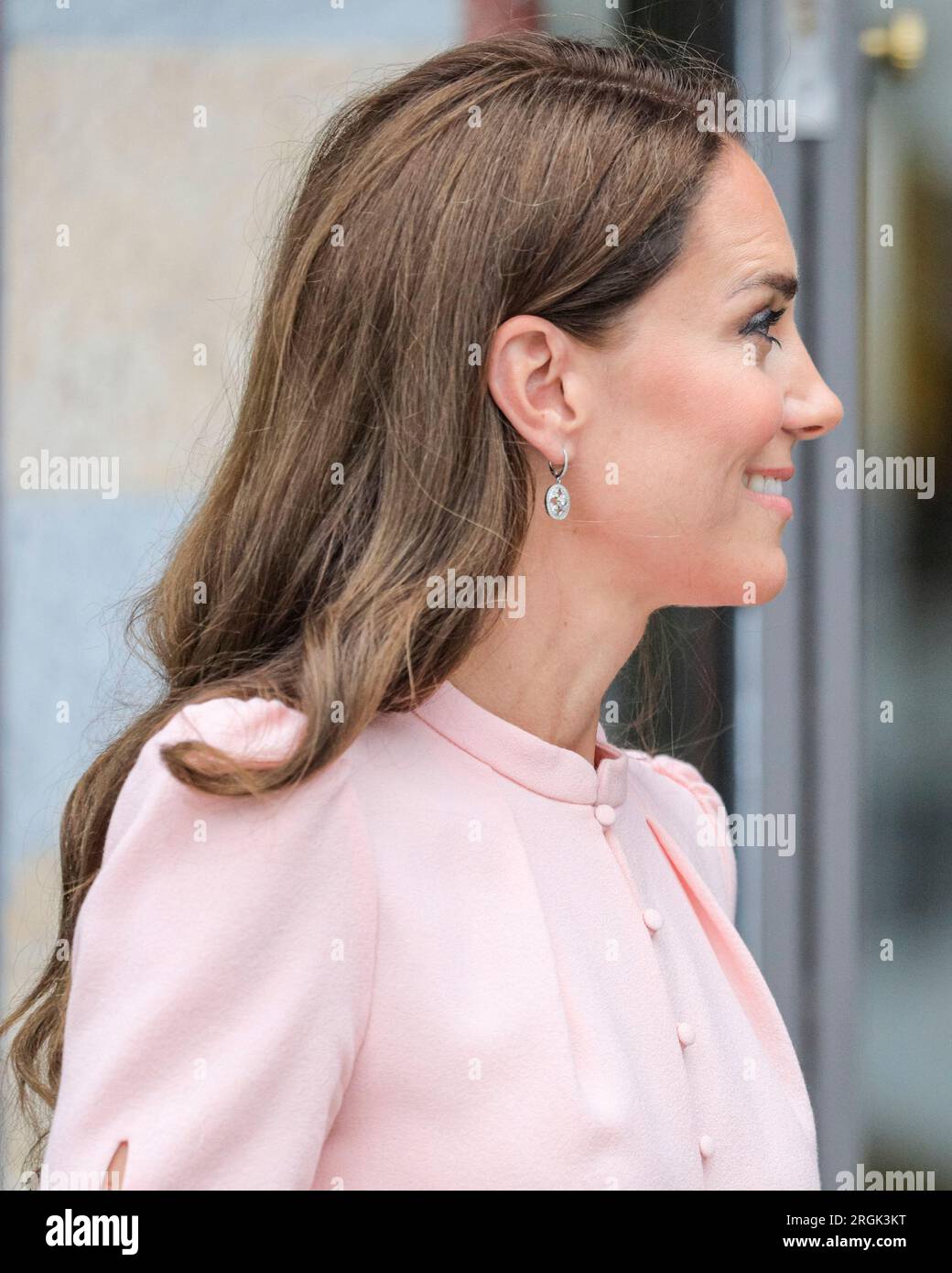 Catherine, the Princess of Wales, in a pink Belua dress, opens the ...