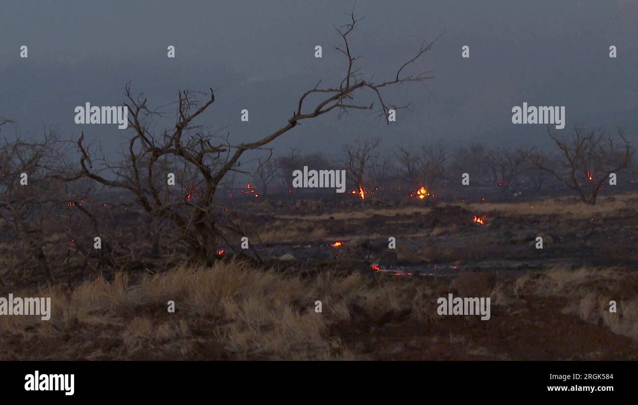 Flames from a wildfire burn in Kihei, Hawaii Wednesday, Aug. 9, 2023 ...