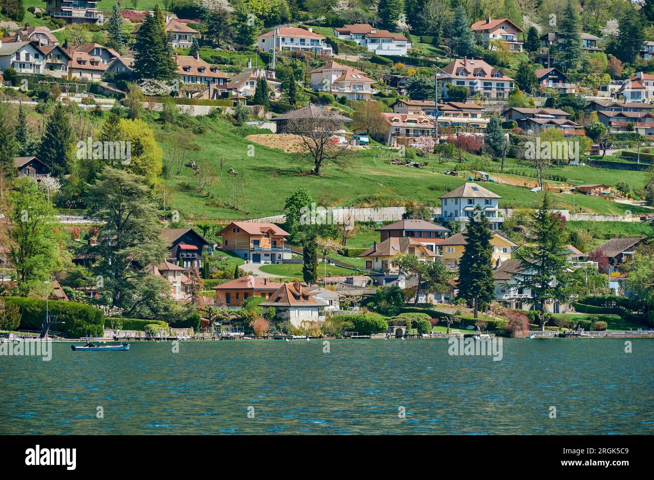 A landscape around Lake Annecy on a sunny day. Lake Annecy is a ...