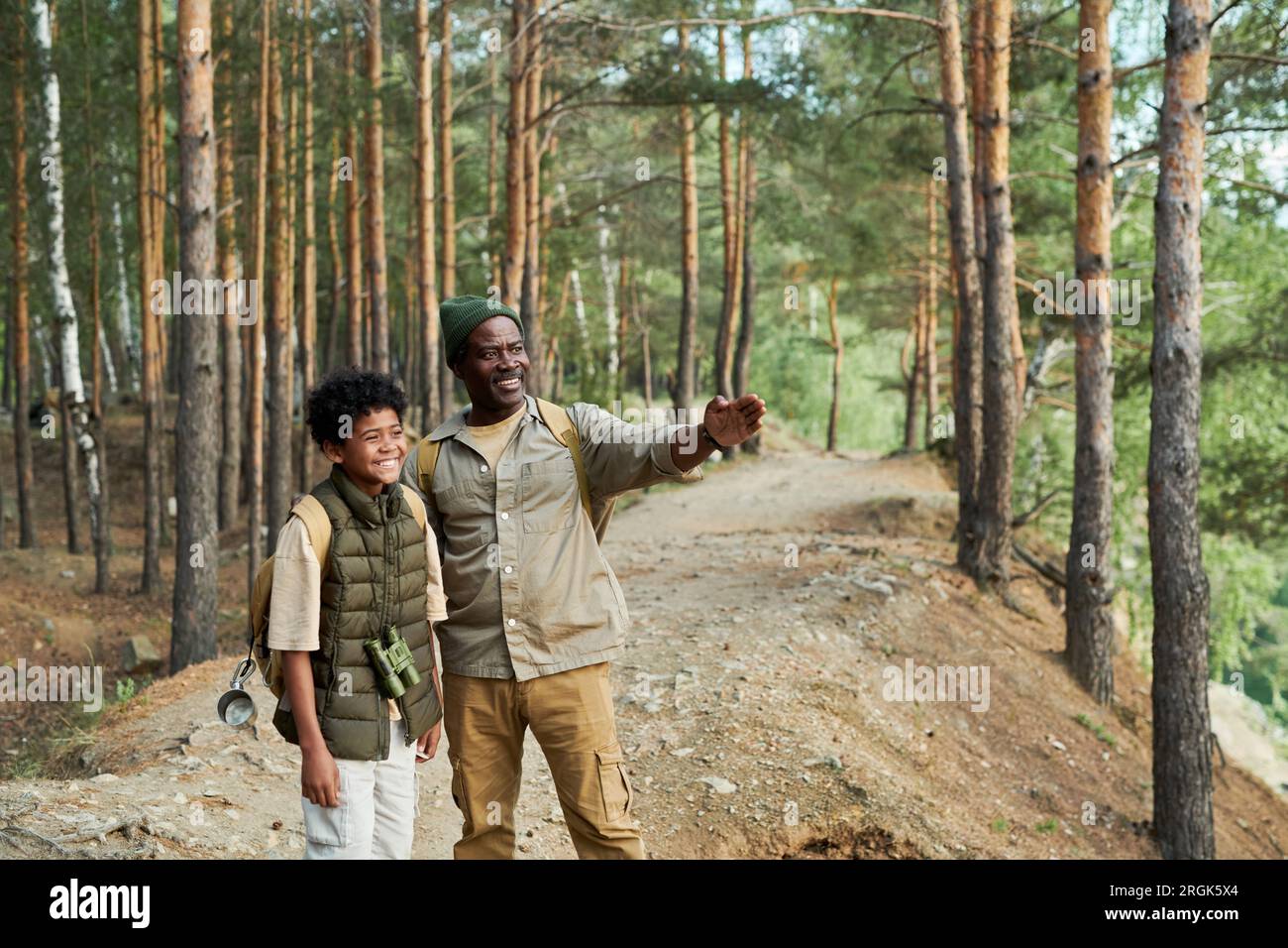 African American dad having travel with his son, they walking in the ...
